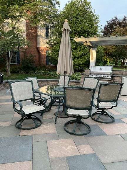 Hexagonal glass top patio table w/ umbrella and set of six arm chairs ...