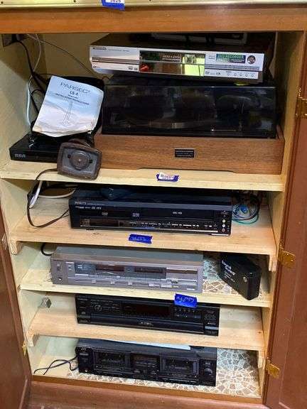 Contents of cupboard: Panasonic DVD records, Realistic turntable ...