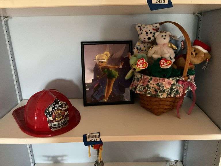 Contents of shelf: Junior Firefighter helmet, Tinkerbell print, Ty ...