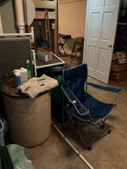 Painting supplies, folding chair, plastic garbage can, exercise ball ...
