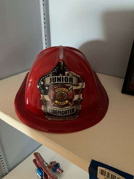Contents of shelf: Junior Firefighter helmet, Tinkerbell print, Ty ...