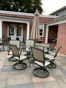 Hexagonal glass top patio table w/ umbrella and set of six arm chairs ...