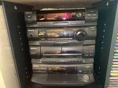 Sony component stereo system in cabinet w/ speaker set and CD, misc ...