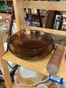 Contents of shelf: Baltimore Oriole mug, wooden stomper, metal cups ...