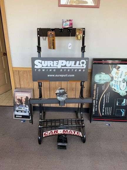 SurePull towing systems display rack with contents - Hurley Real Estate ...