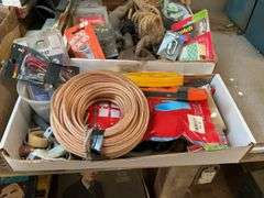 Misc tools, hardware, fan, and items hanging on wall above - Hurley Real Estate & Auctions