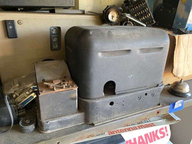 Contents of shelf: electronics including Teletype machine, Wollensak 3M reel-to-reel tape player ...