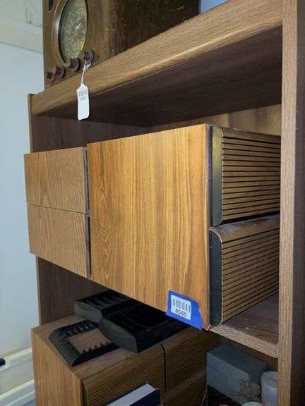 Contents of two shelves: tape storage units, adding machine tape, wire ...