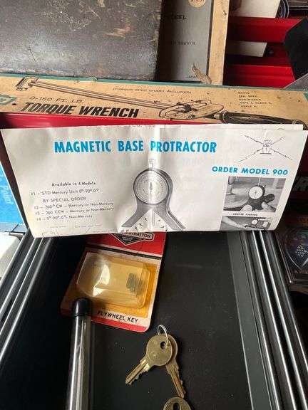 Contents of drawer: Erick Miracle Point protractor, tire gauge, brass ...