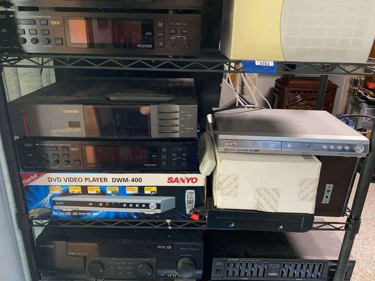 Contents of shelf: Toshiba remote control transmitter, NEC sound ...