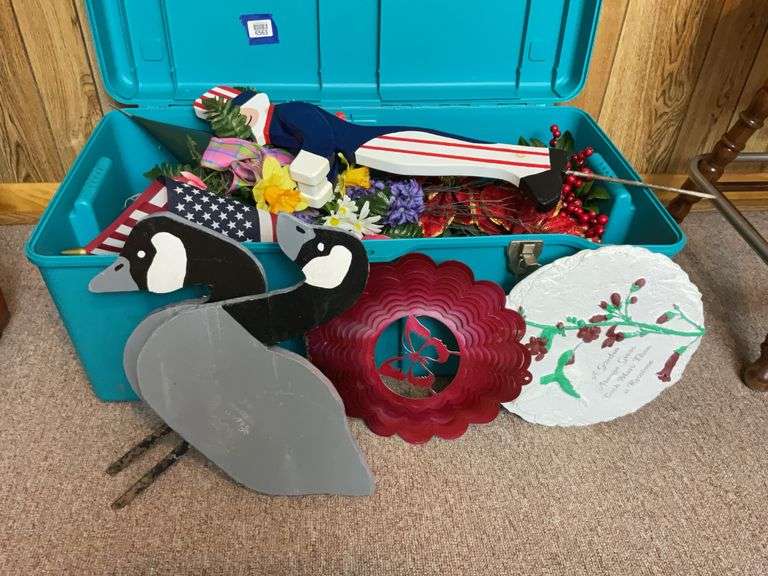 Uncle Sam cutout and garden decor and faux flowers in plastic tote ...