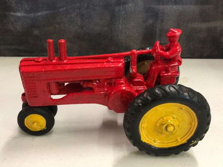 Vintage red toy tractor - Integrity Auctioneers