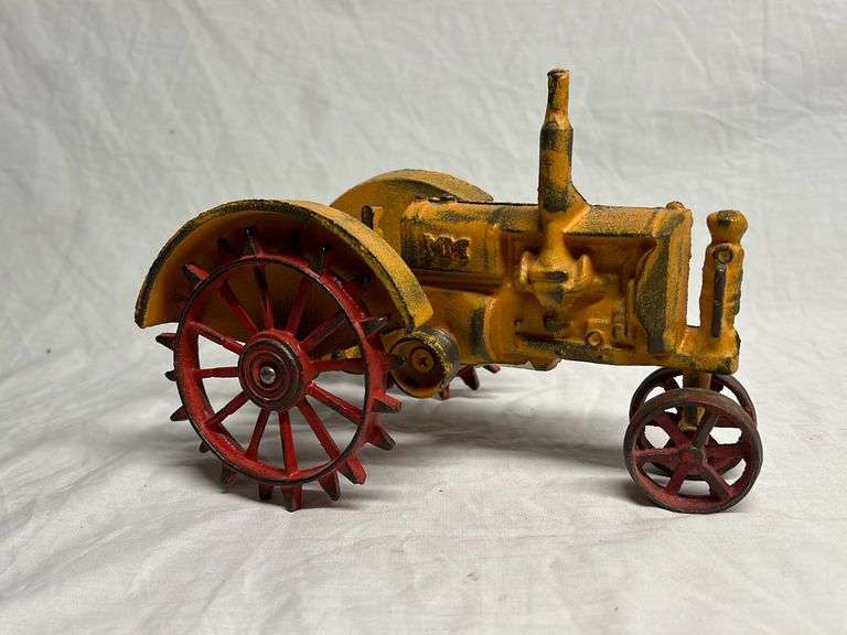 Group of 4 cast iron tractors - Integrity Auctioneers