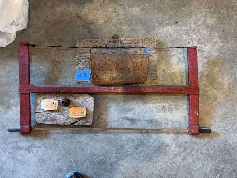 Buck Saw, Belt Buckles, Leg Bucket, & Grease Cup - Integrity Auctioneers
