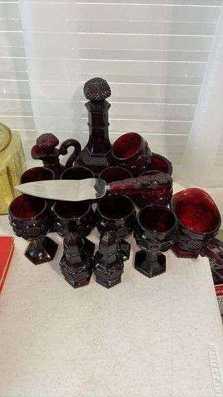 (D) 15 PIECES OF RUBY RED DECANTER, GLASSES, CRUET, CREAM AND SUGAR, SALT AND PEPPER, CAKE ...