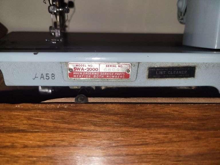 (LB) DELUXE PUSH BUTTON SEWING MACHINE AND CABINET - Isabell Auction