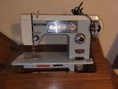 (LB) DELUXE PUSH BUTTON SEWING MACHINE AND CABINET - Isabell Auction