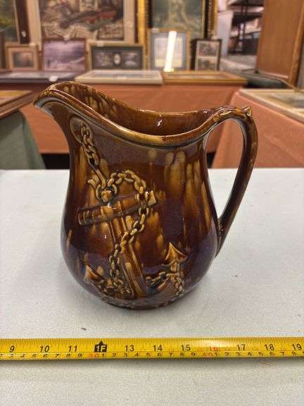 GLAZED POTTERY PITCHER (HANDLE HAS BEEN REPAIRED) - Isabell Auction