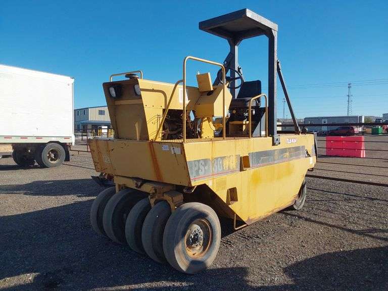 1995 Cat PS-130 9 Wheel Pneumatic Roller - J&J Auctioneers LLC