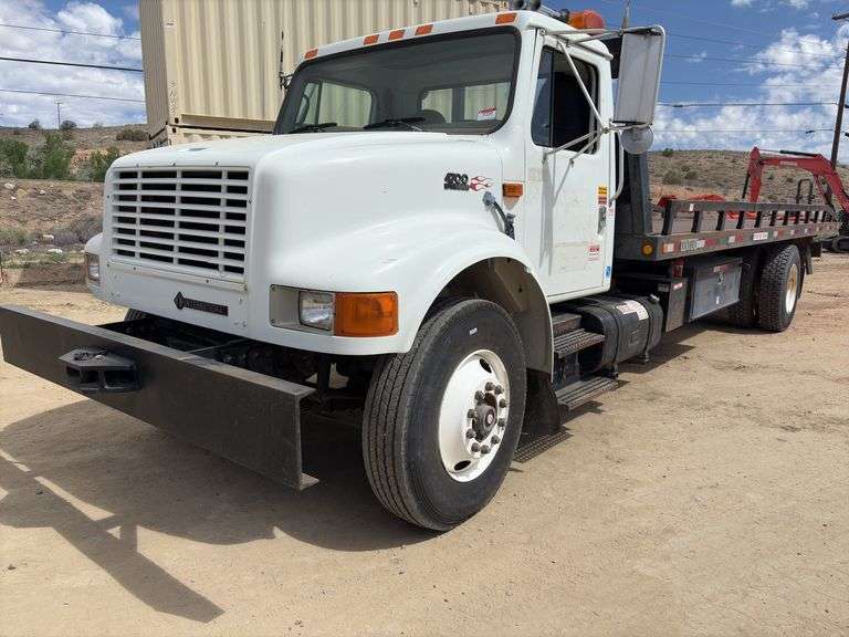 1996 International 4700 S/A Roll Back Truck I - J&J Auctioneers LLC