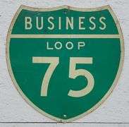 (AI) One Metal Business Loop 75 Road Sign - Kraft Auction Service, LLC