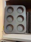 Contents Of Cabinet Cooking Sheets, Muffin Pans, Cooling Rack, and More ...