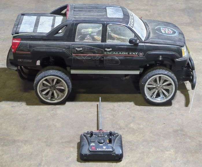 (C) New Bright Escalade Remote Control Car - Kraft Auction Service, LLC
