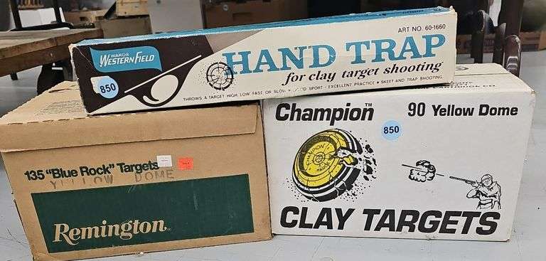 2 boxes of Clay Pigeons & Hand Trap Thrower - Kramer Auction LLC