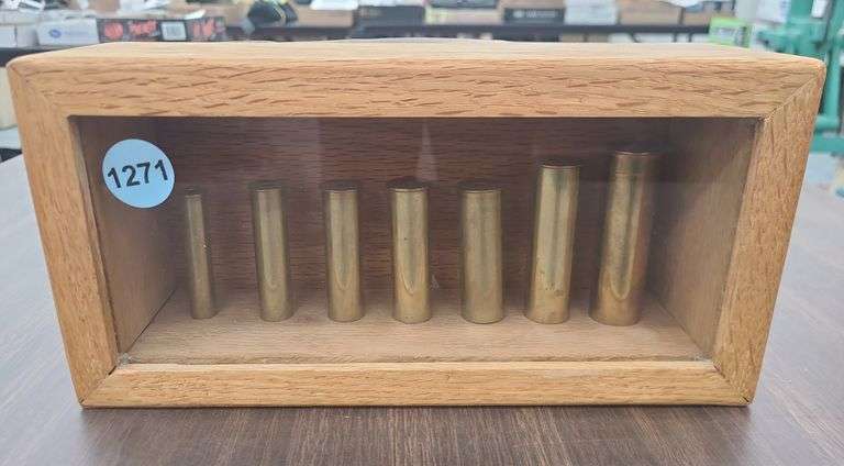 Display of Brass Shotgun Shells in case - Kramer Auction LLC