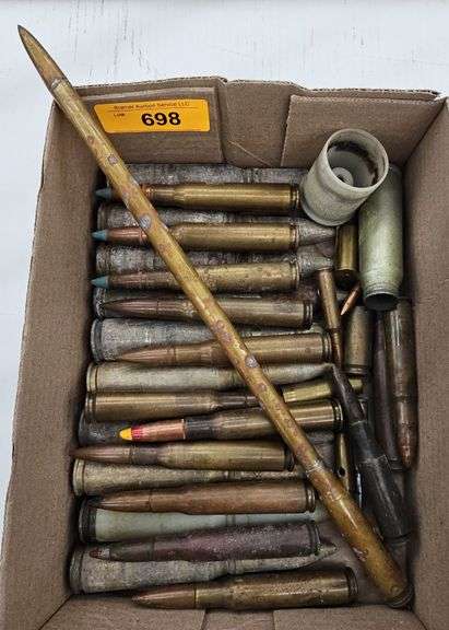 flat of assorted Large Military Rounds - Kramer Auction LLC