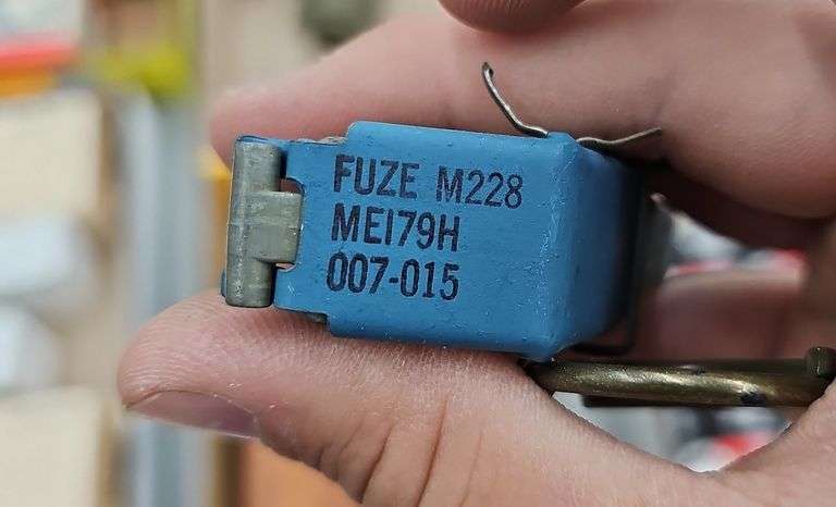 lot of 4 M49A1 Flares, plus 2 - M228 Grenade Fuses - Kramer Auction LLC