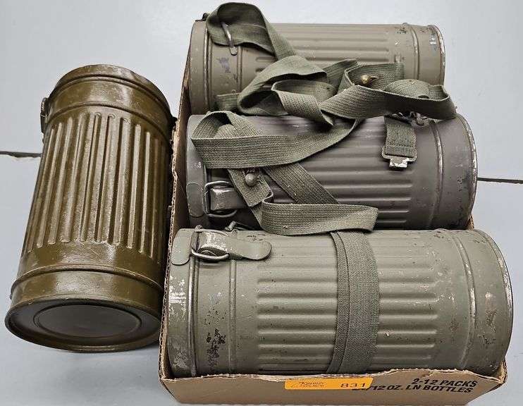 4 German Style Gas Masks in cans - Kramer Auction LLC