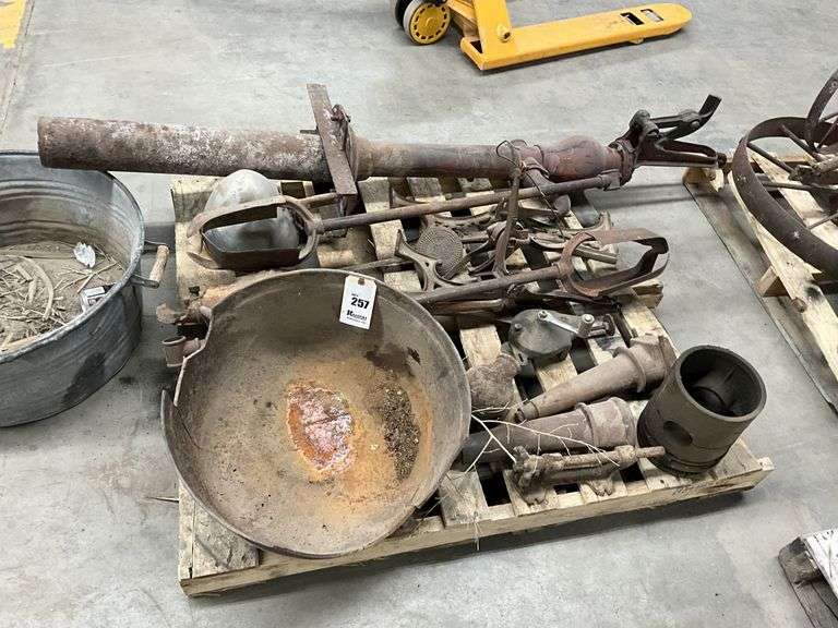 Antique iron pieces including an old picture pump with a broken handle ...