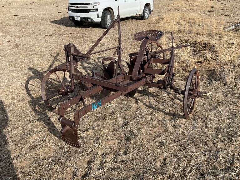 Antique 2 Bottom Disk Plow with Seat - Kraupie's Real Estate & Auctioneers