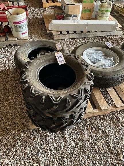 25 x10.00 x 12NHS Four Wheel Tires - Kraupie's Real Estate & Auctioneers