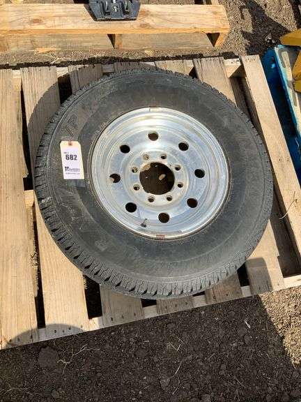 235/85/R16 Tire, Aluminum Rim - Kraupie's Real Estate & Auctioneers