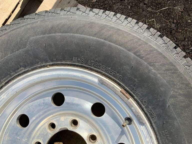 235/85/R16 Tire, Aluminum Rim - Kraupie's Real Estate & Auctioneers
