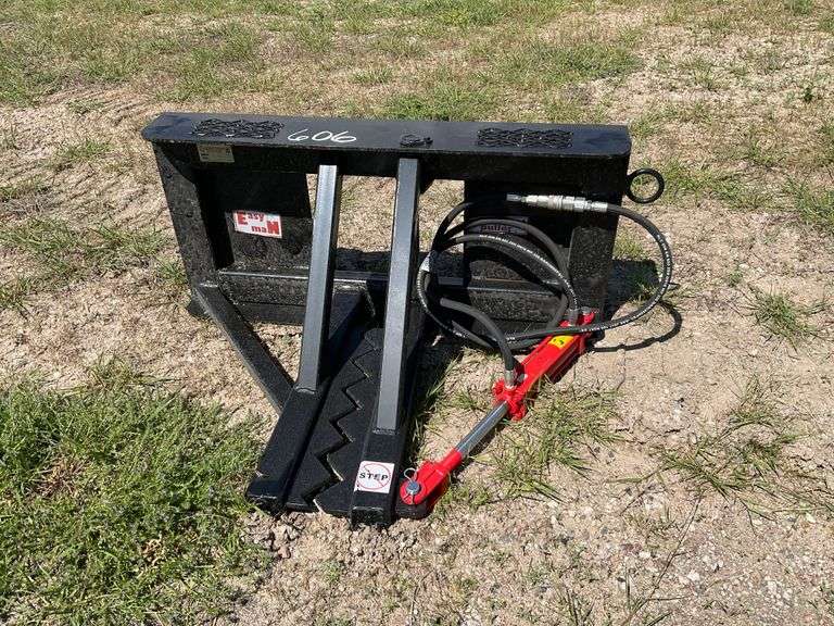 New Skid Steer Tree Puller - Kraupie's Real Estate & Auctioneers