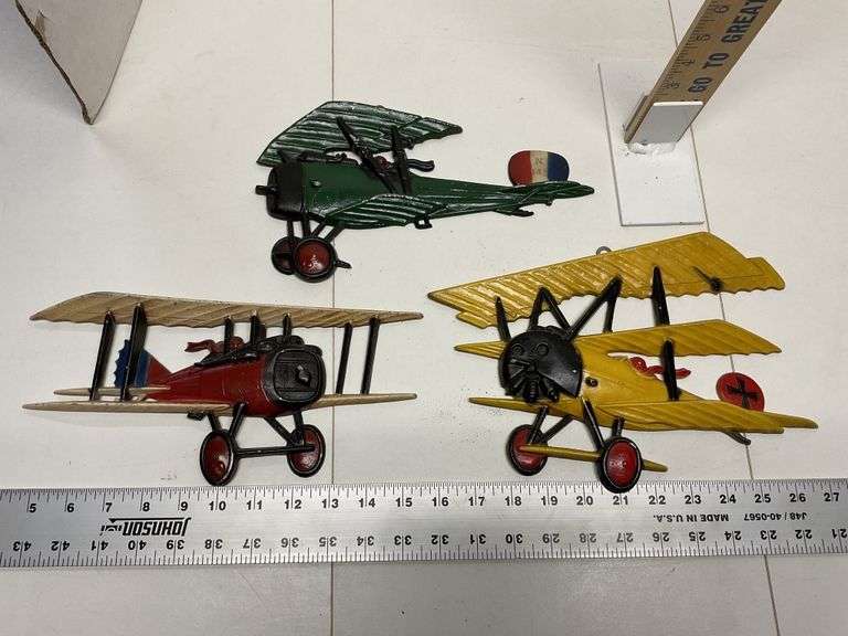 Metal decorative airplane wall plaques - Legacy Auction Company