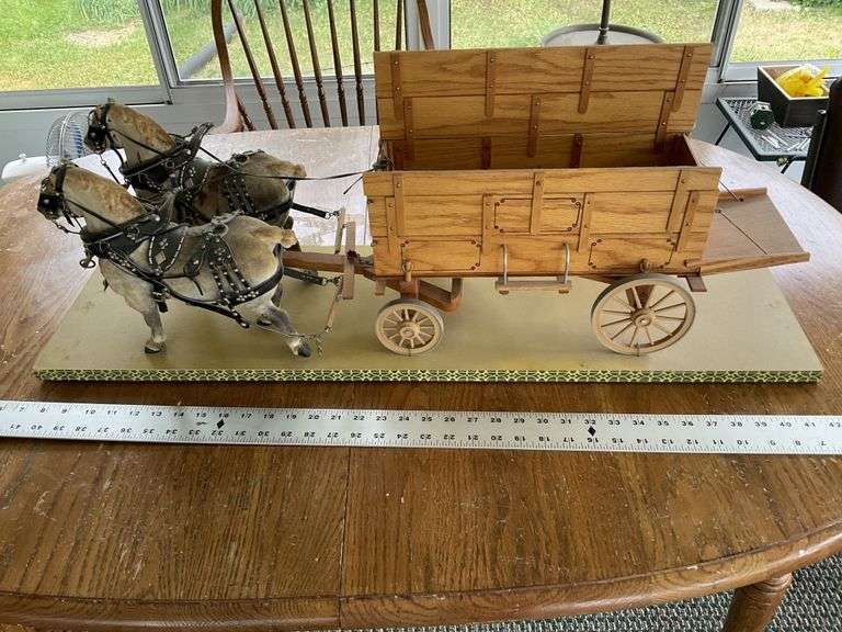 Percheron hitch with triple box wagon. Bang - Legacy Auction Company