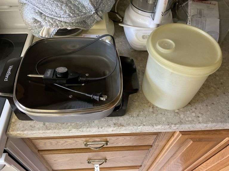 West Bend electric skillet, Tupperware container - Legacy Auction Company
