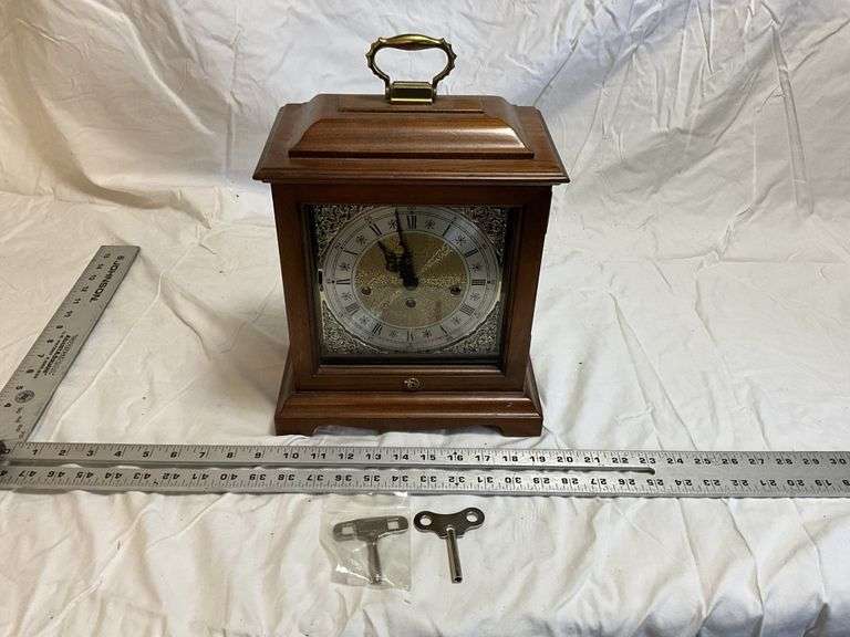 Howard Miller clock w/keys - Legacy Auction Company