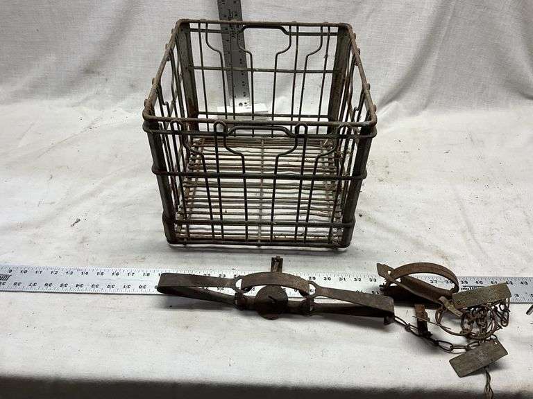 Metal milk crate, traps - Legacy Auction Company