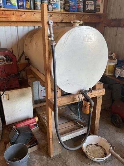 150 gallon gasoline fuel barrel on stand with 9" - Legacy Auction Company