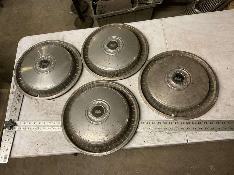 Ford wheel covers - Legacy Auction Company