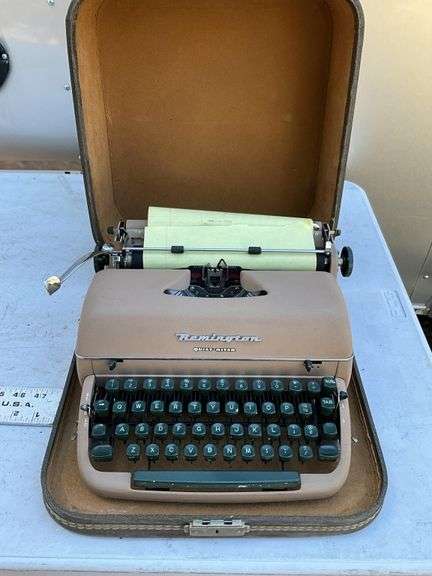 Remington typewriter and Sears adding machine - Legacy Auction Company
