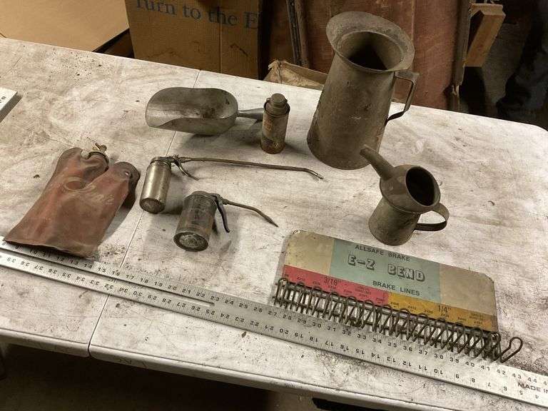 Vintage brake line display, oil measures ,cans - Legacy Auction Company