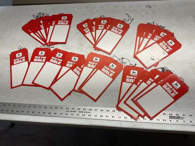 Vintage John Deere red tags - Legacy Auction Company