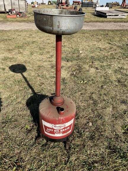 Rolling/adjustable drain oil stand - Legacy Auction Company