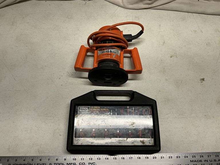 Router bit set and Black & Decker router - Legacy Auction Company